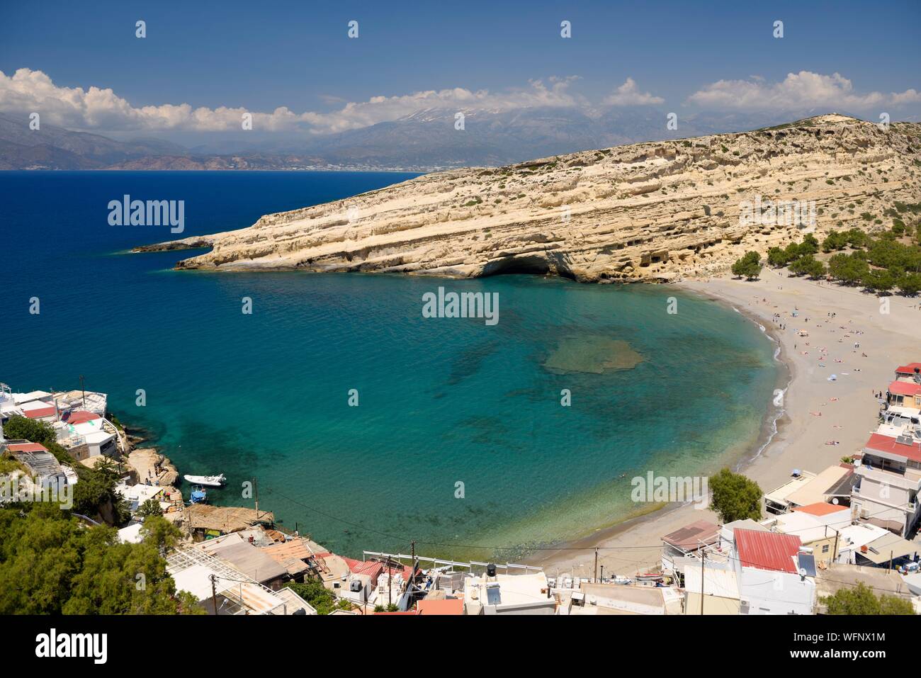 Greece, Crete, Matala, Matala Bay, beach and caves seen from the south ...