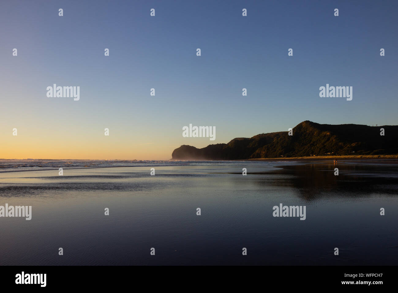 sunset at Piha beach, North Island, New Zealand Stock Photo - Alamy