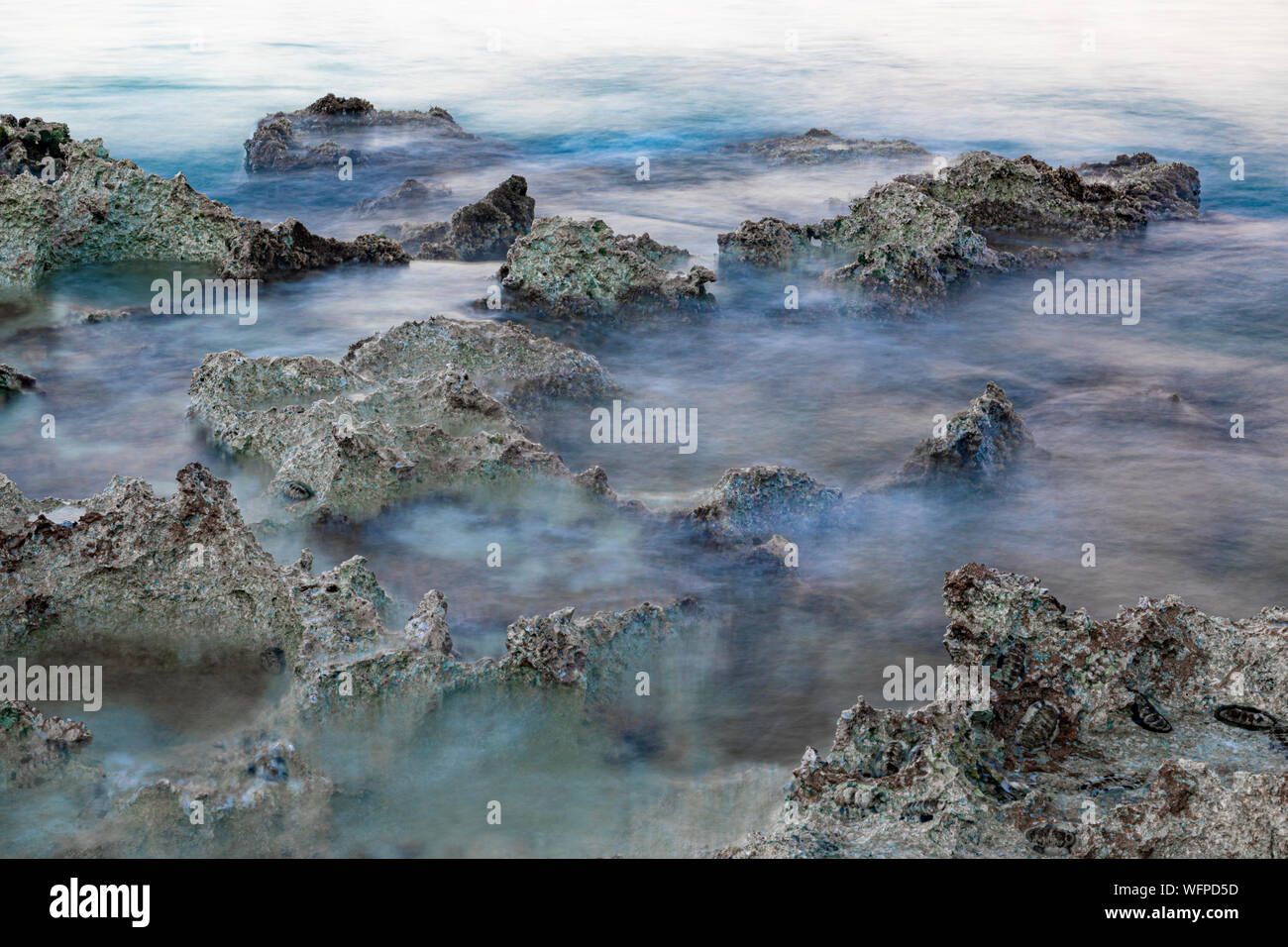 Tide pools and rocks, long exposure Stock Photo - Alamy