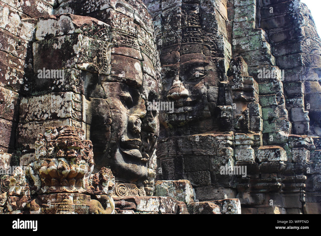 Ancient stone faces of Bayon temple, Angkor Wat, Siam Reap, Cambodia ...
