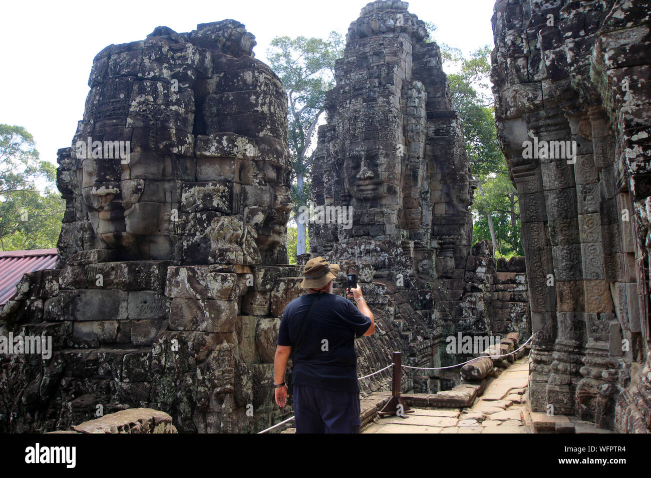 Ancient stone faces of Bayon temple, Angkor Wat, Siam Reap, Cambodia ...