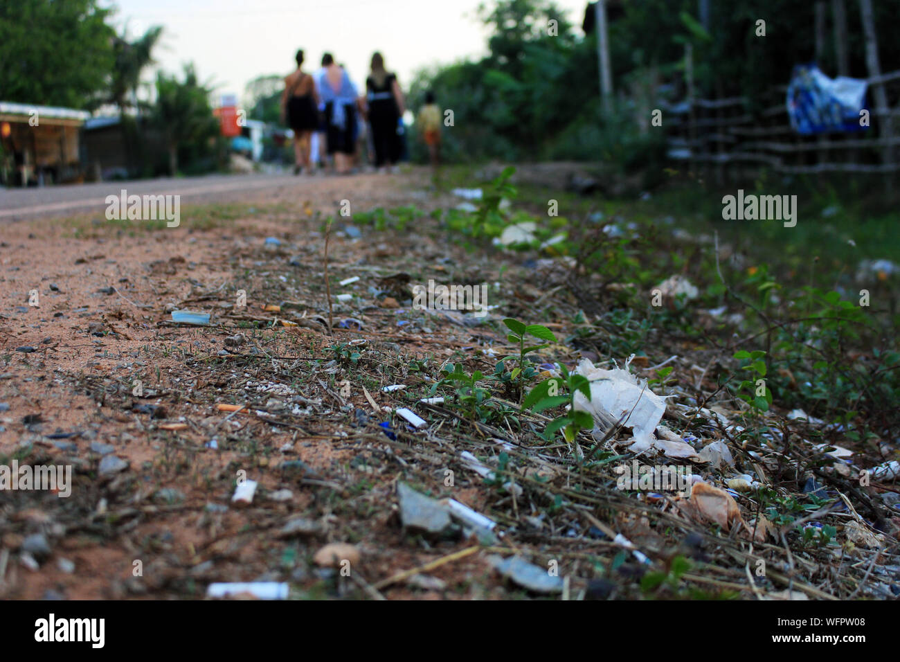 plastic waste on the side of the road in southeast asia. pollution ...