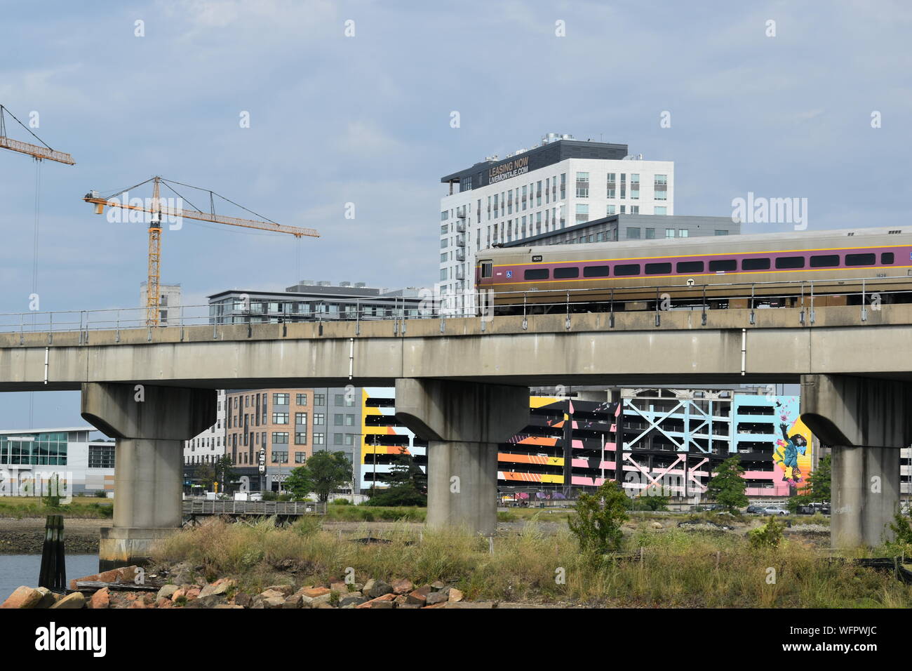 An MBTA Commuter Rail train passing over the Mystic River on the ...