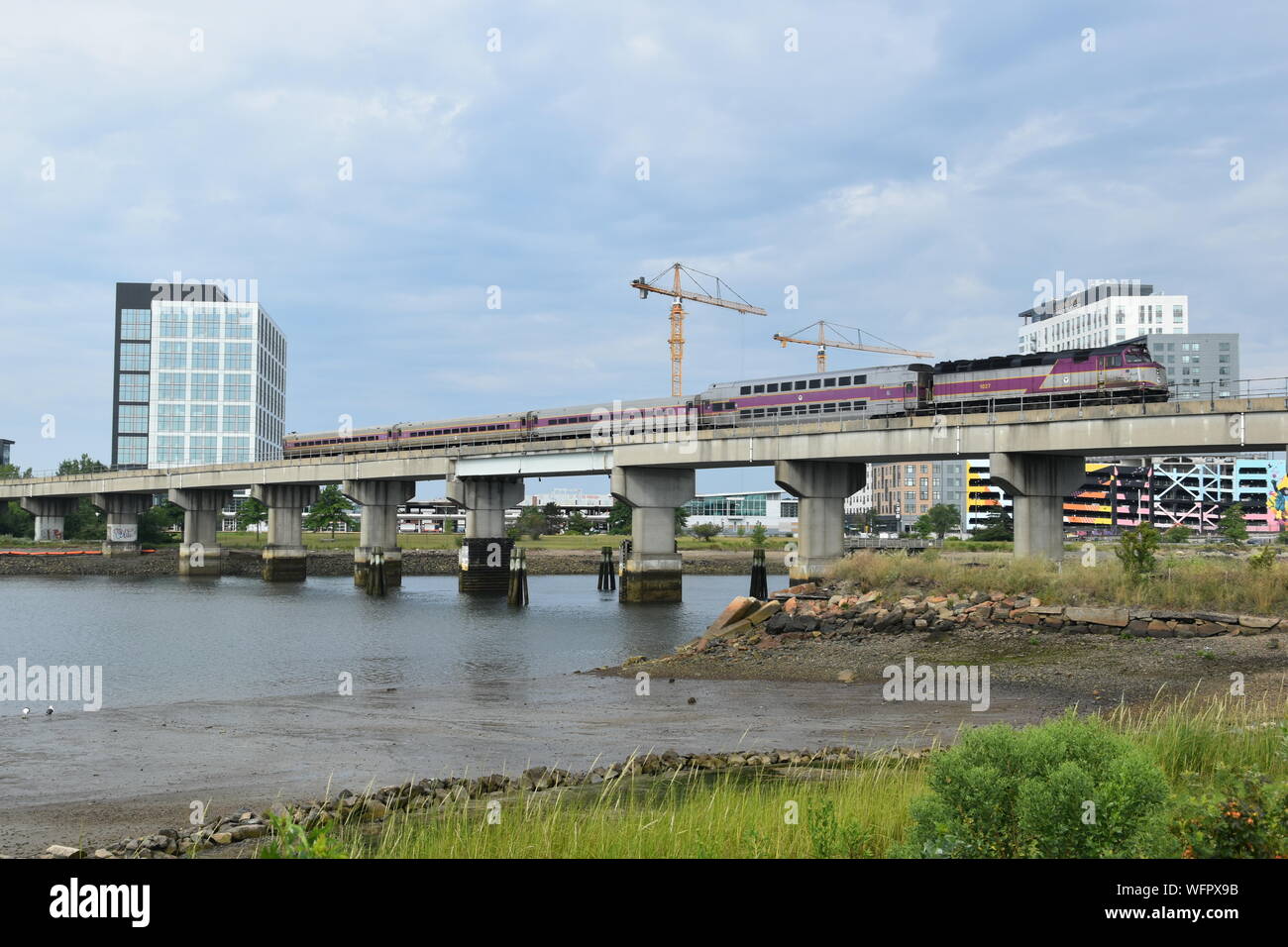 An MBTA Commuter Rail train passing over the Mystic River on the ...