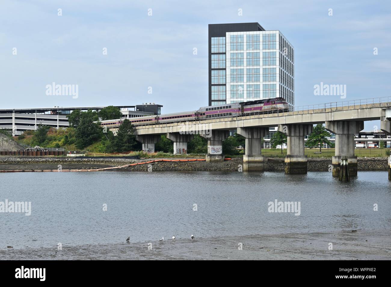 An MBTA Commuter Rail train passing over the Mystic River on the ...