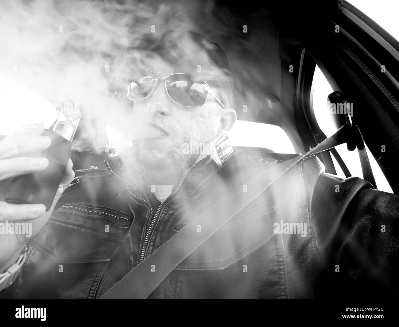 Adult smoking in car hi-res stock photography and images - Alamy