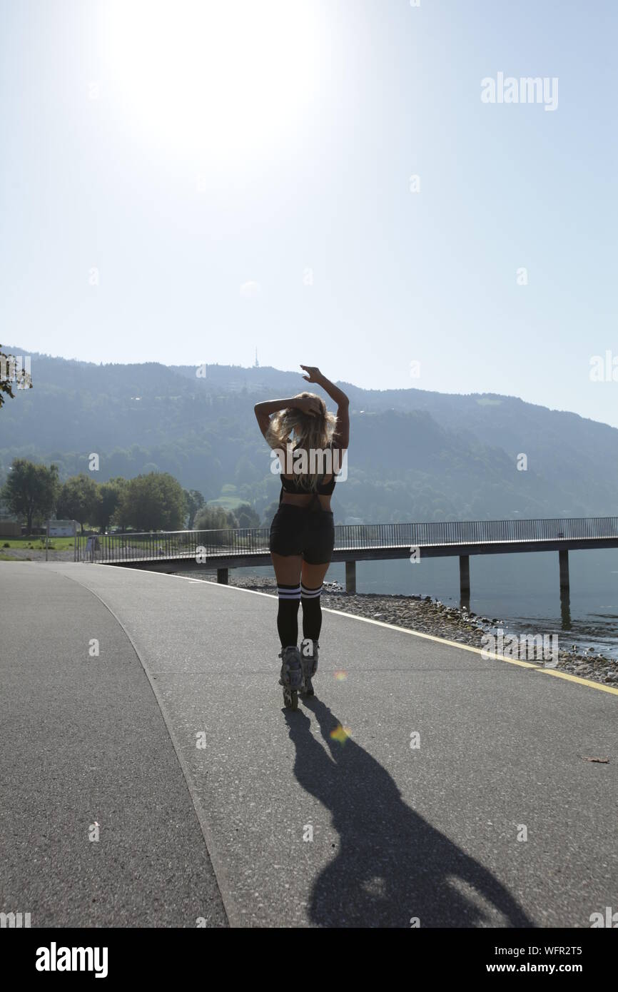 Woman inline skating road activity hi-res stock photography and images ...