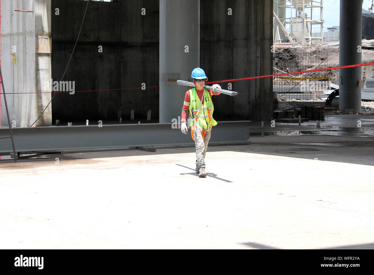 Construction worker carrying pipes hi-res stock photography and images ...