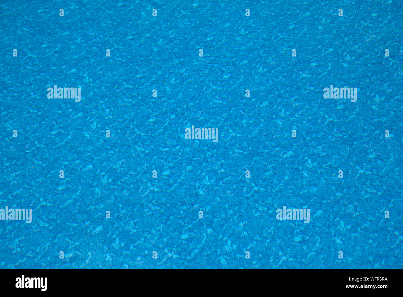 The floor or deep end of a swimming pool with underwater abstract ...
