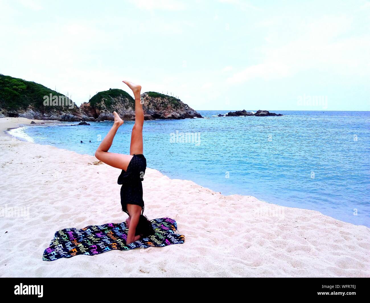 Woman Headstand Beach High Resolution Stock Photography and Images - Alamy