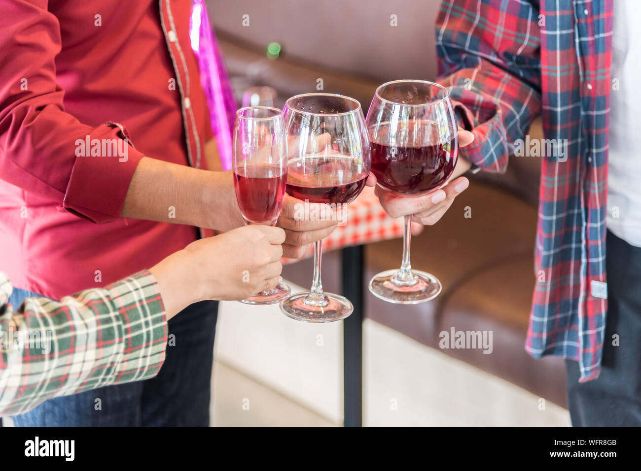 Men friends toasting party hi-res stock photography and images - Alamy