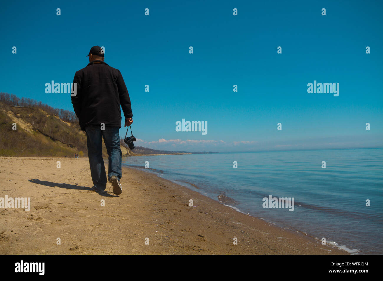 Man walking with camera hi-res stock photography and images - Alamy
