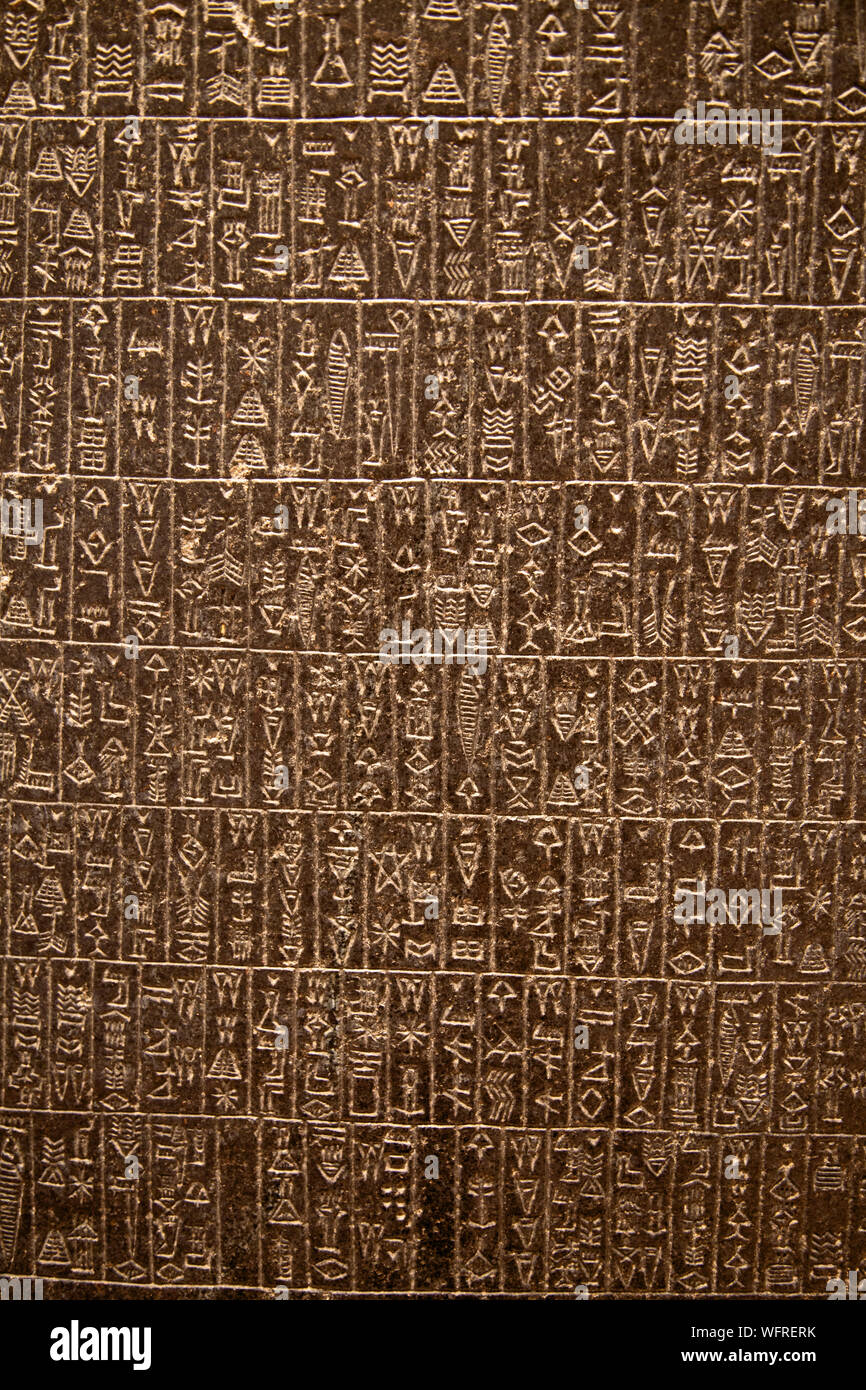 Ancient sumerian stone carving with cuneiform scripting Stock Photo - Alamy