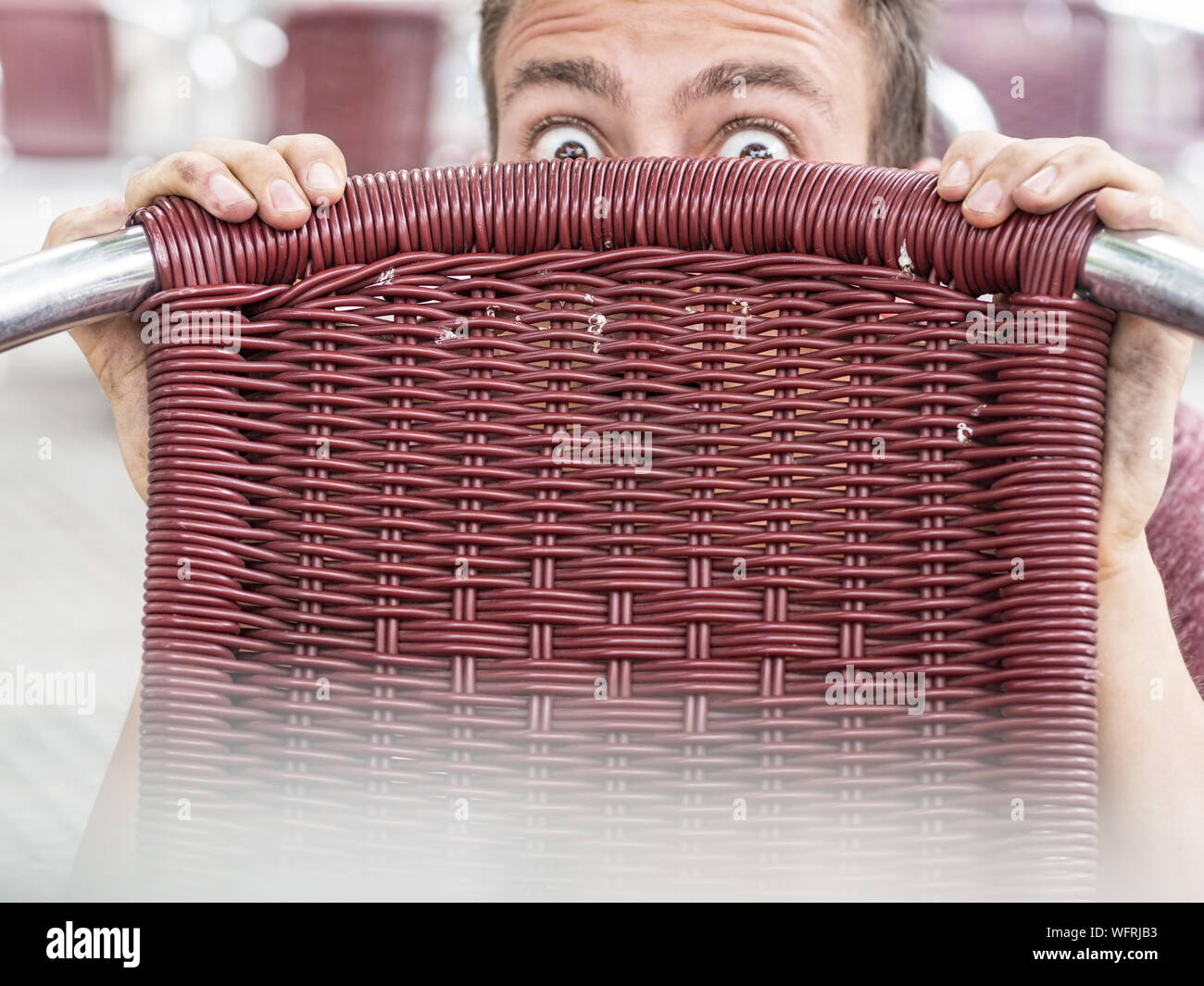 Young man chair hi-res stock photography and images - Alamy