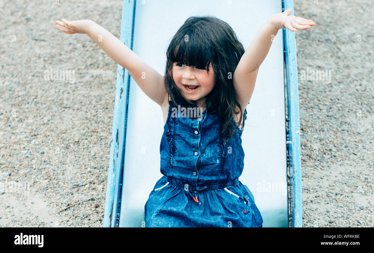 Girl on slide hi-res stock photography and images - Alamy