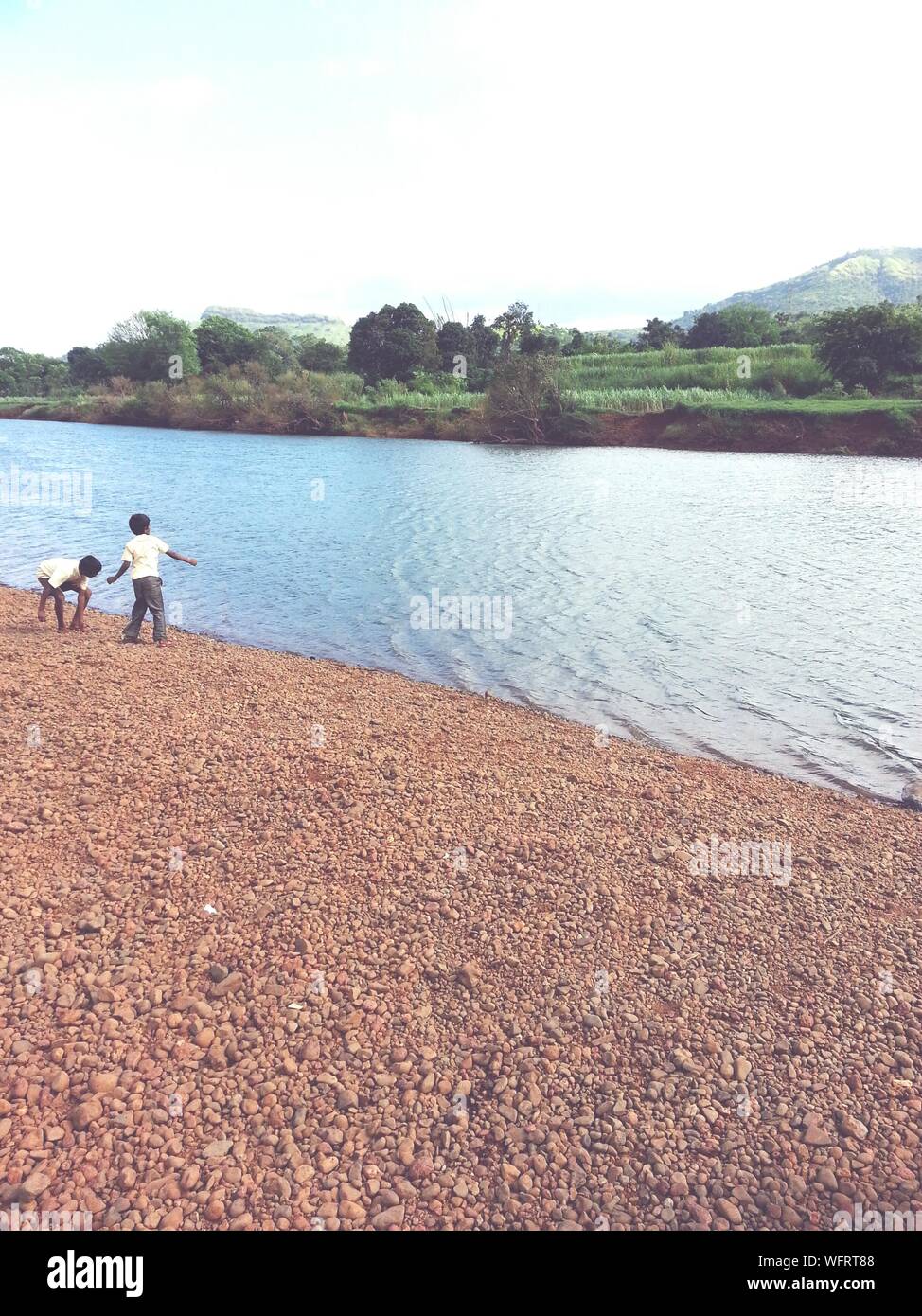 Two boys playing river hi-res stock photography and images - Alamy