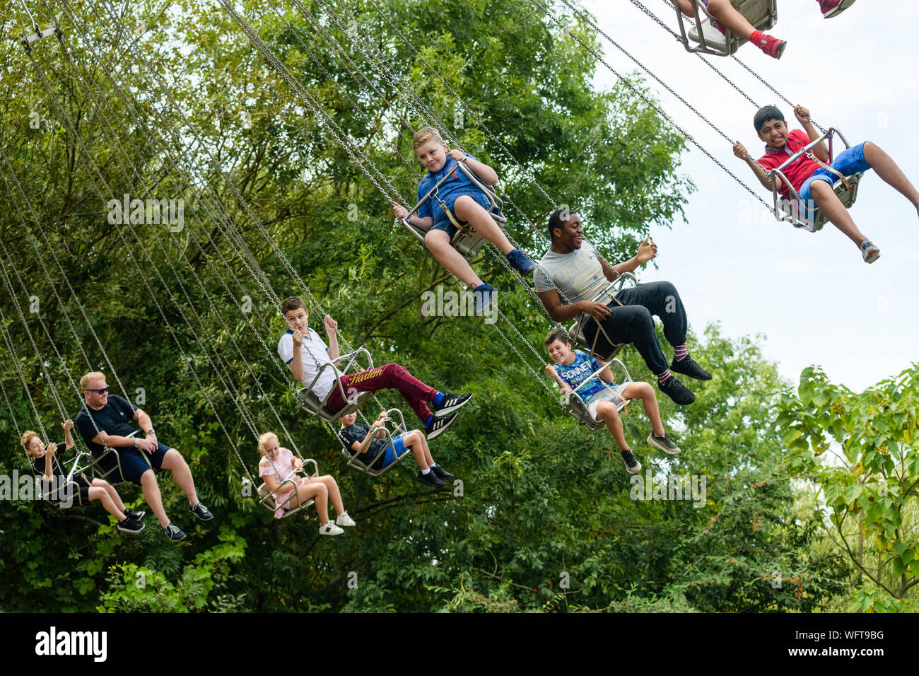 Group spinning roundabout hi-res stock photography and images - Alamy