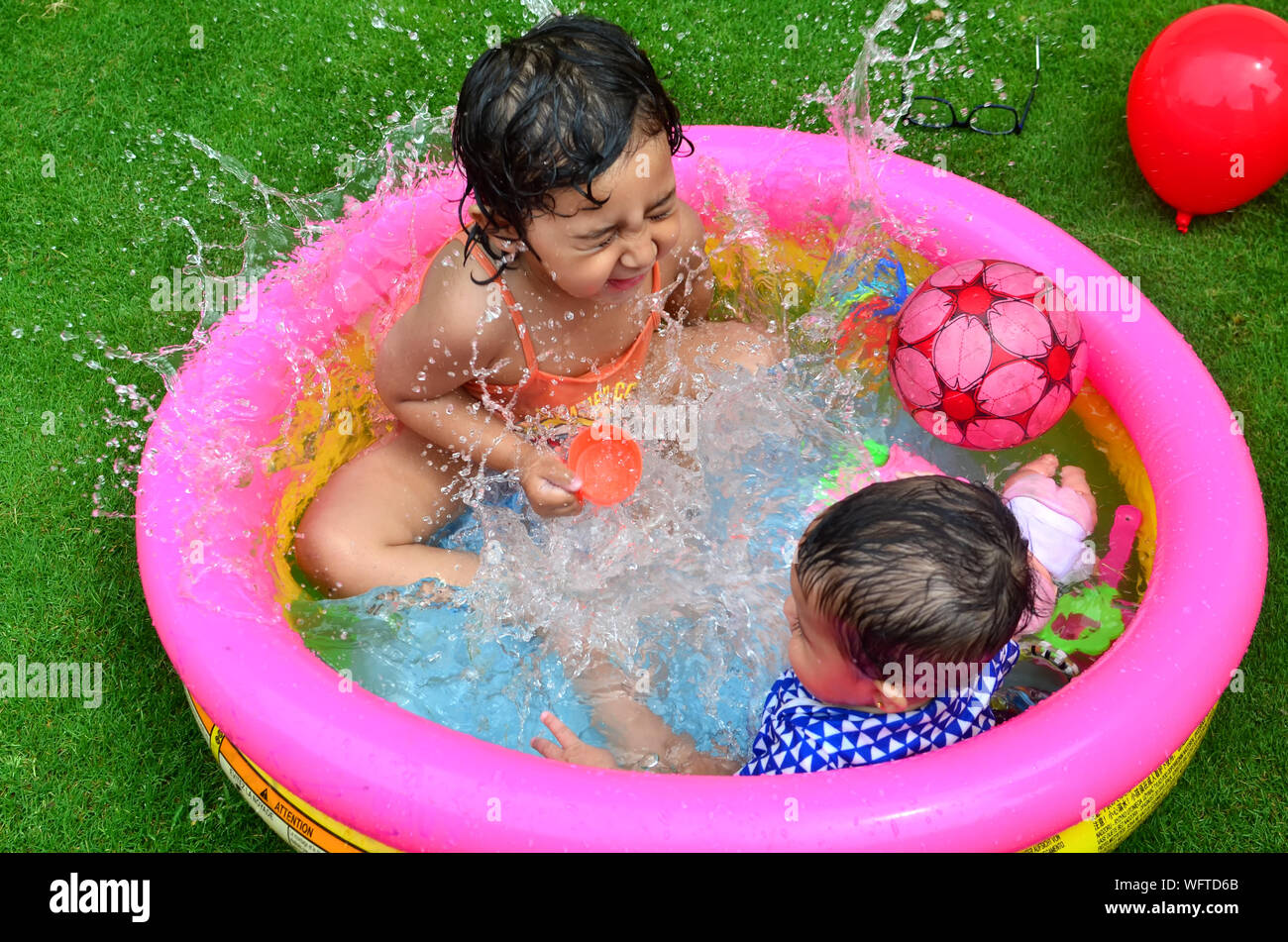 Children playing swimming pool hi-res stock photography and images - Alamy