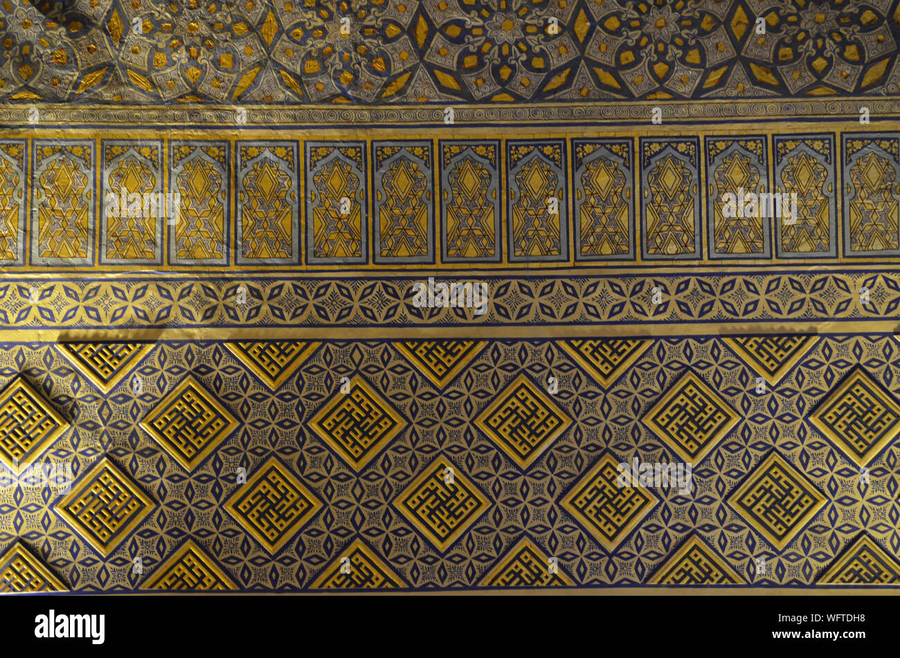 Elaborated ceiling and wall ornaments at the Gur-e Amir mausoleum ...