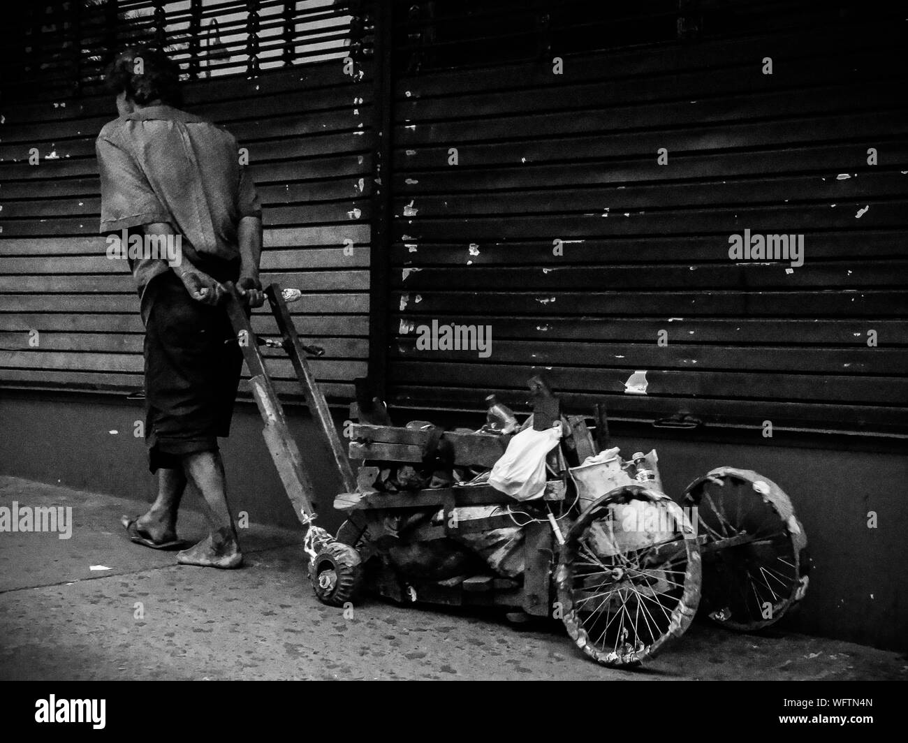 Homeless man cart hi-res stock photography and images - Alamy
