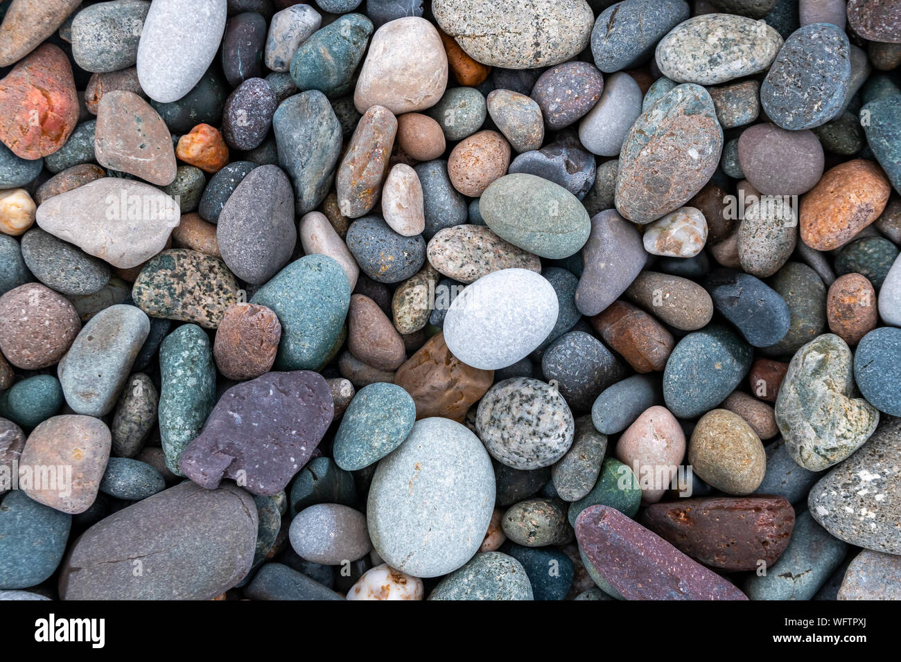 Rounded grey granite rocks beach hi-res stock photography and images ...
