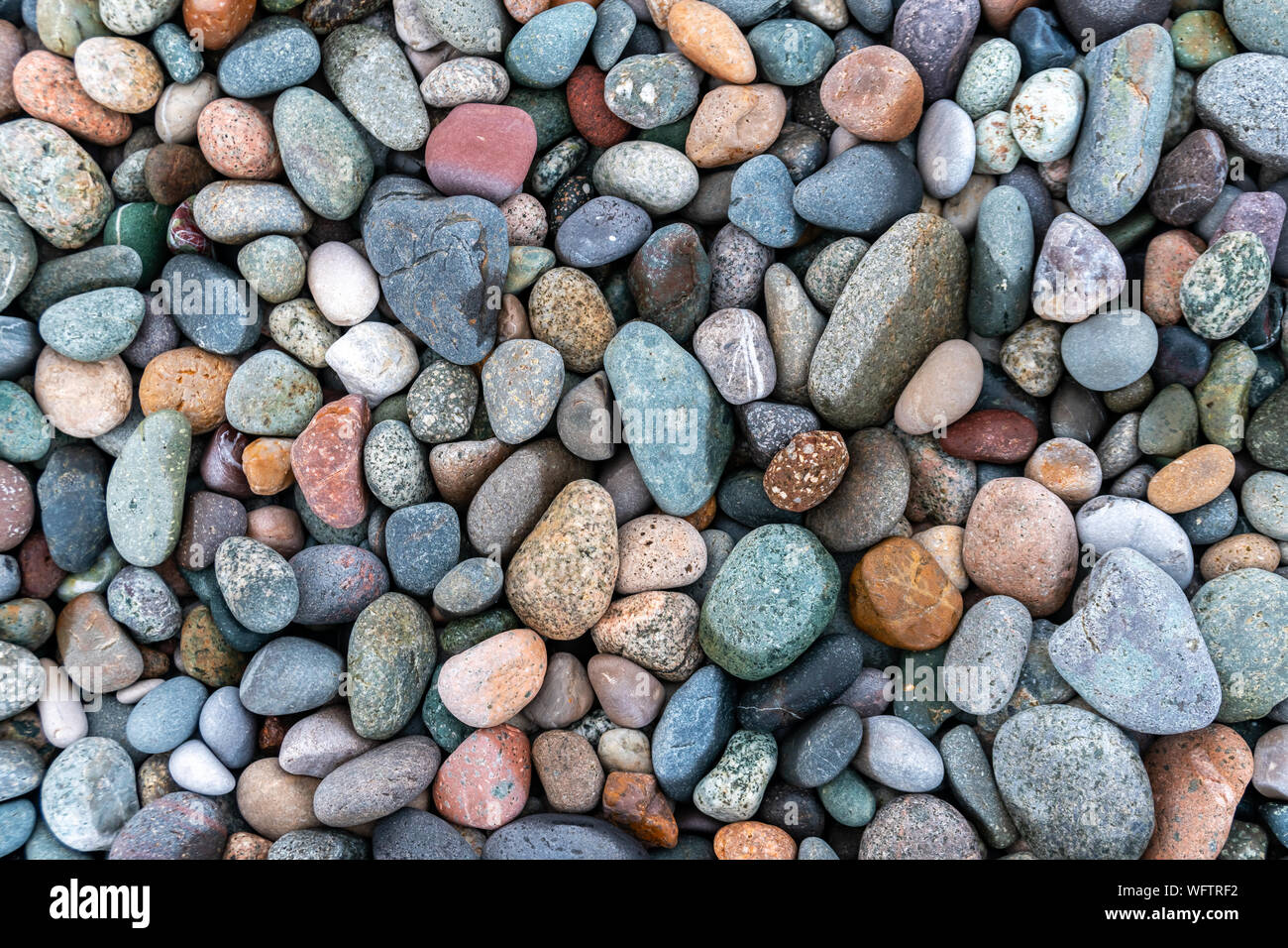 Rounded grey granite rocks beach hi-res stock photography and images ...