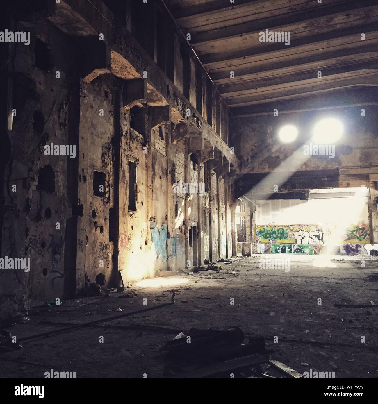 Sunlight Falling Through Hole On Abandoned Factory Stock Photo - Alamy