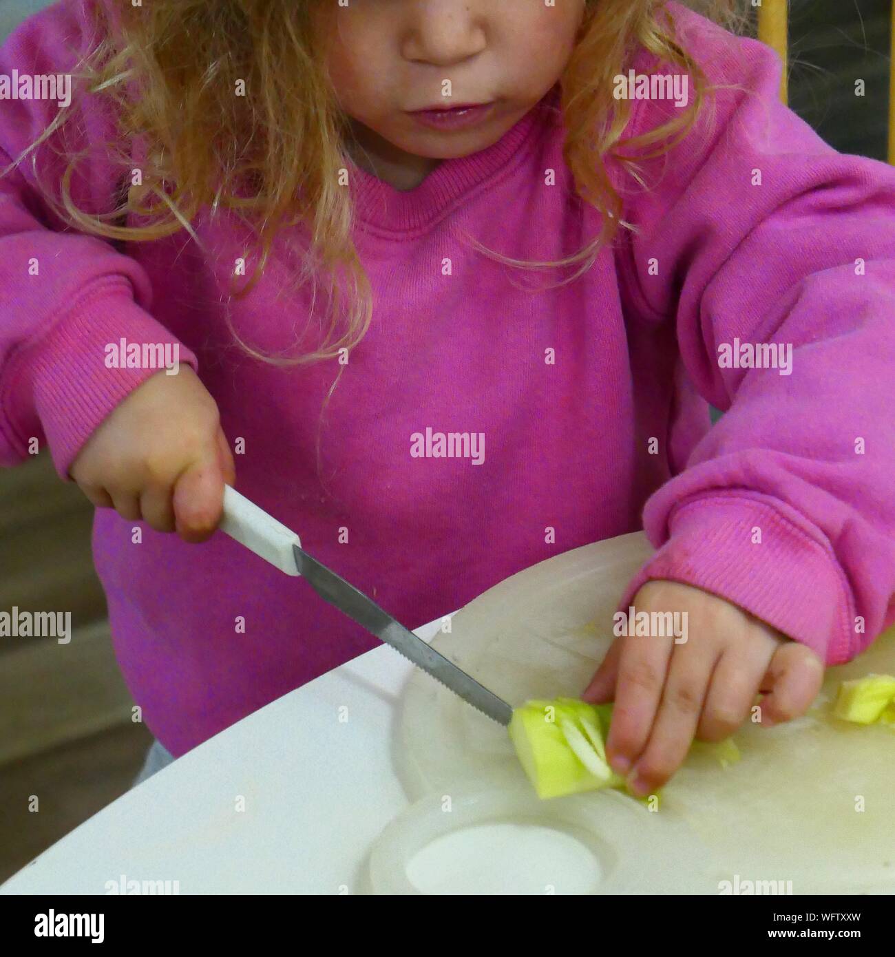 Child cutting food with knife hi-res stock photography and images - Alamy