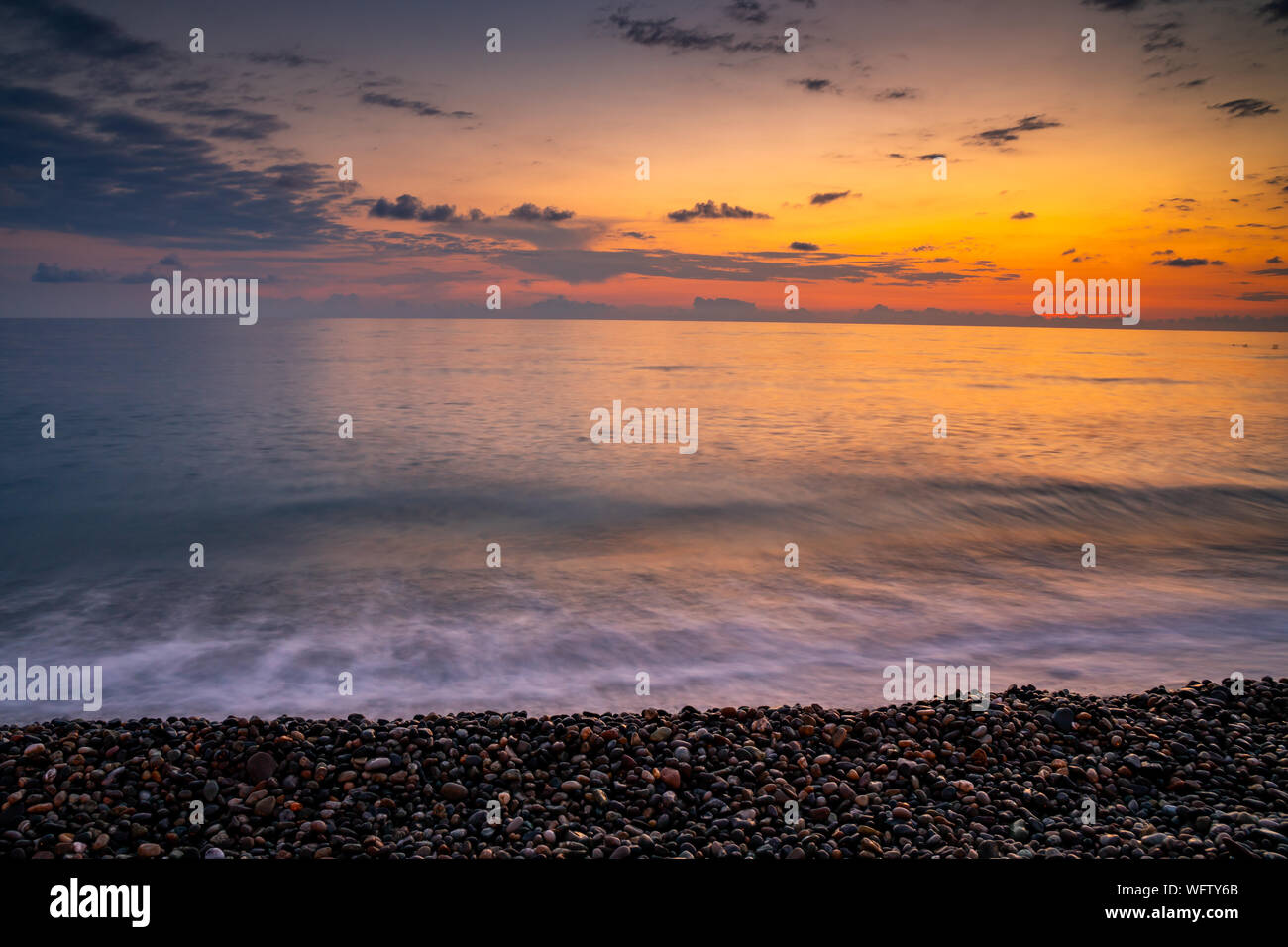 Sea waves of Black sea on Kvariati beach in Georgia. Beautiful sunset ...