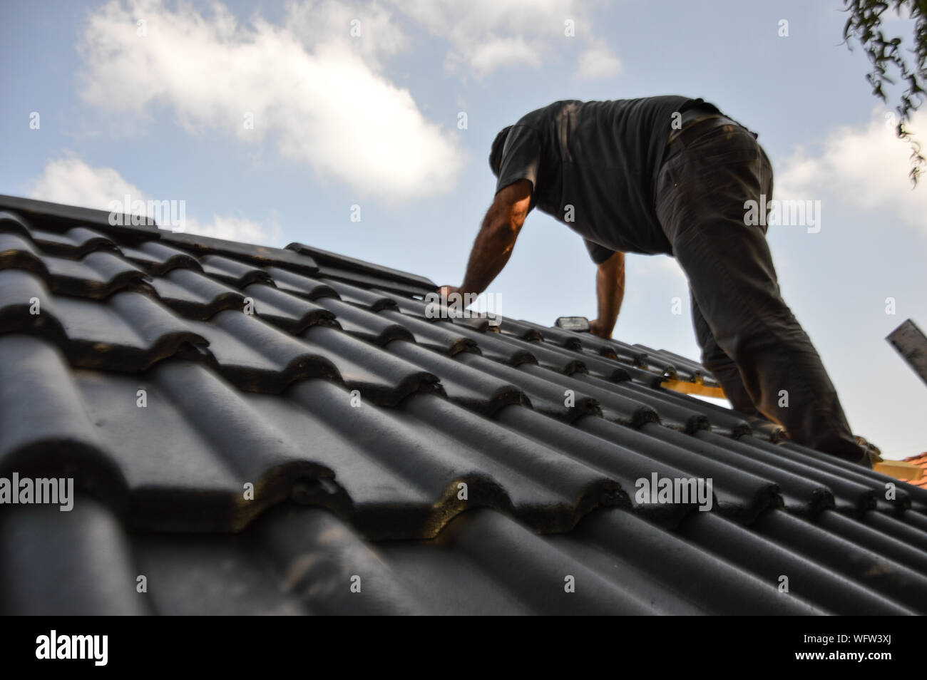 Climbing on roof hi-res stock photography and images - Alamy