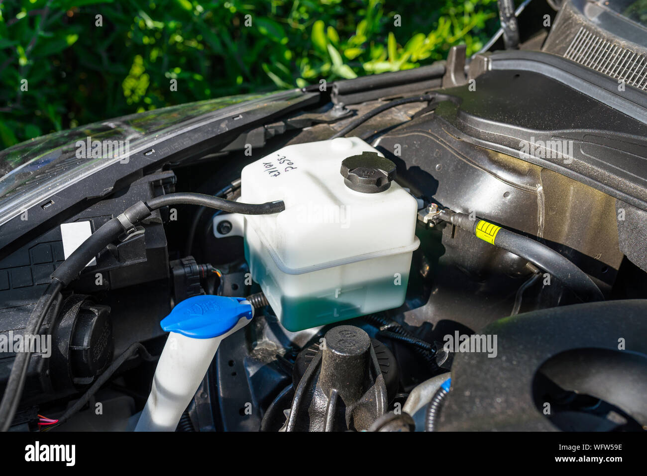 New reservoir for cooling liquid inside the engine compartment Stock ...