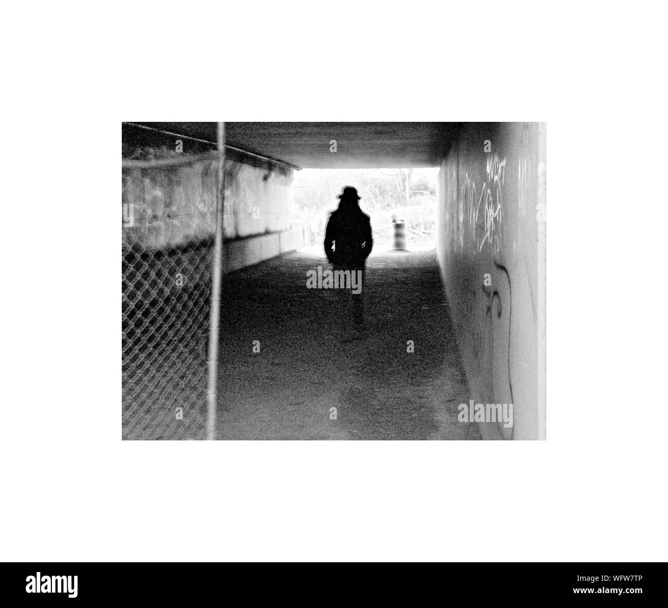 Silhouette man walking under bridge hi-res stock photography and images ...