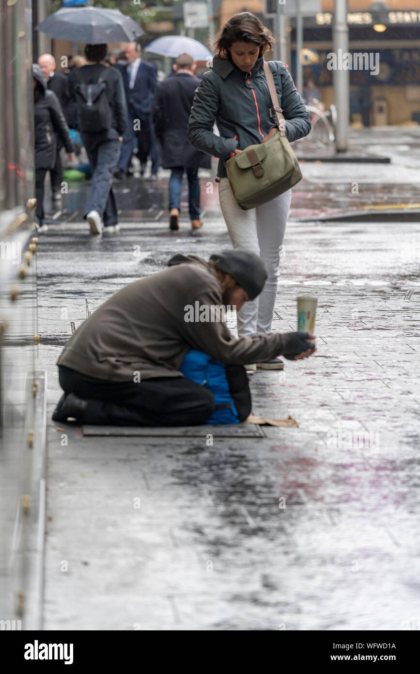 Homeless woman sleeping on street hi-res stock photography and images ...