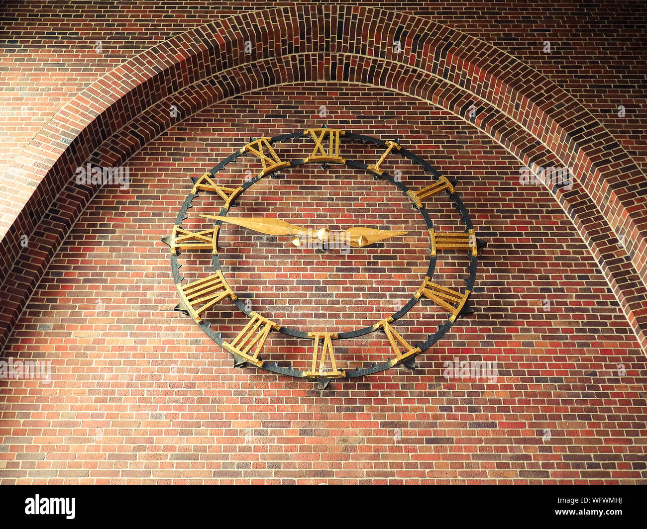 Brick wall with clock hi-res stock photography and images - Alamy