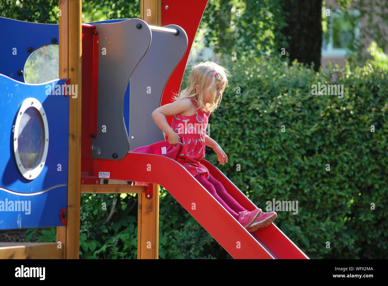 Girl child park playground slide hi-res stock photography and images ...