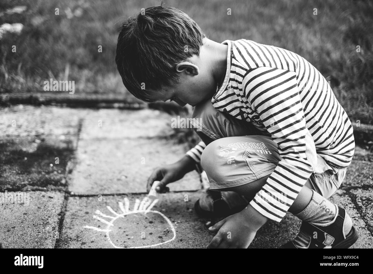 Full length boy side view Black and White Stock Photos & Images - Alamy