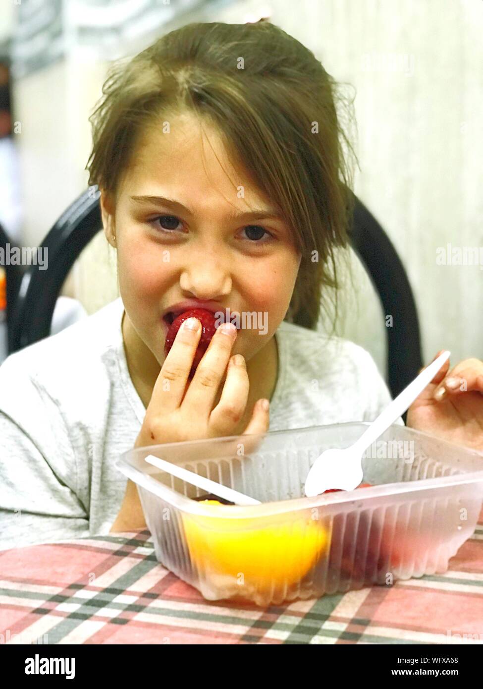 Girl eating fruit hi-res stock photography and images - Alamy