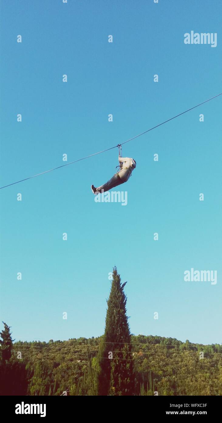 Person zip lining hi-res stock photography and images - Alamy