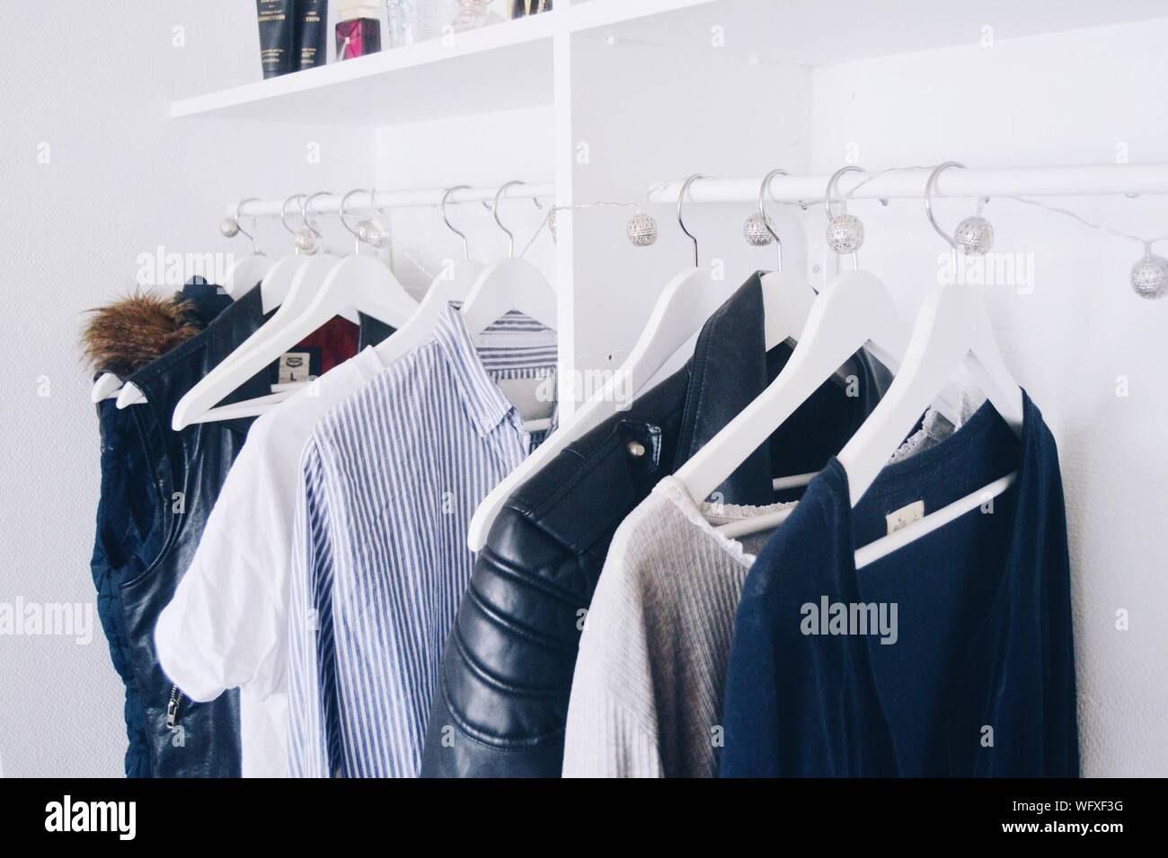 Hanging shirts on rack hi-res stock photography and images - Alamy