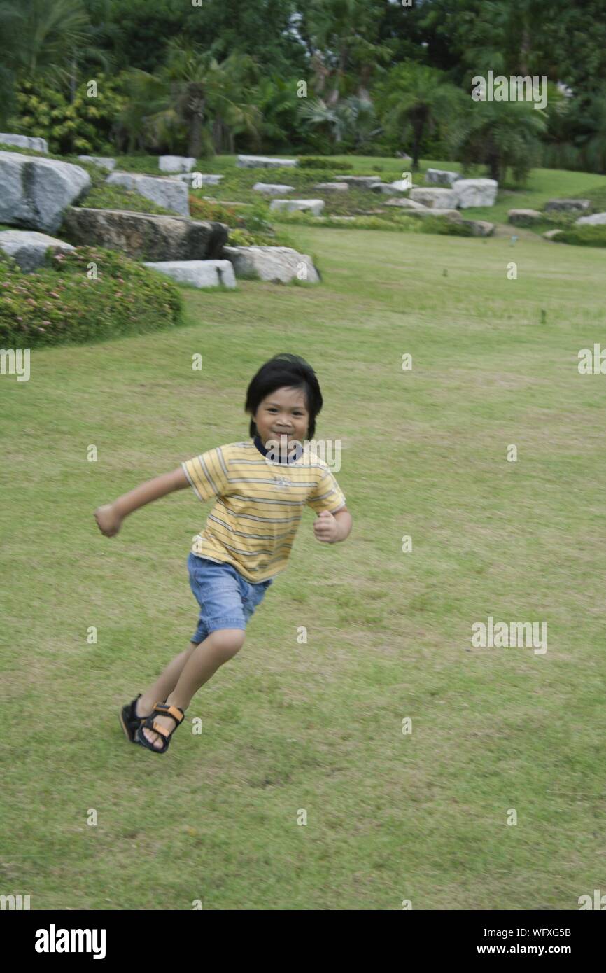 Asian boys running hi-res stock photography and images - Alamy