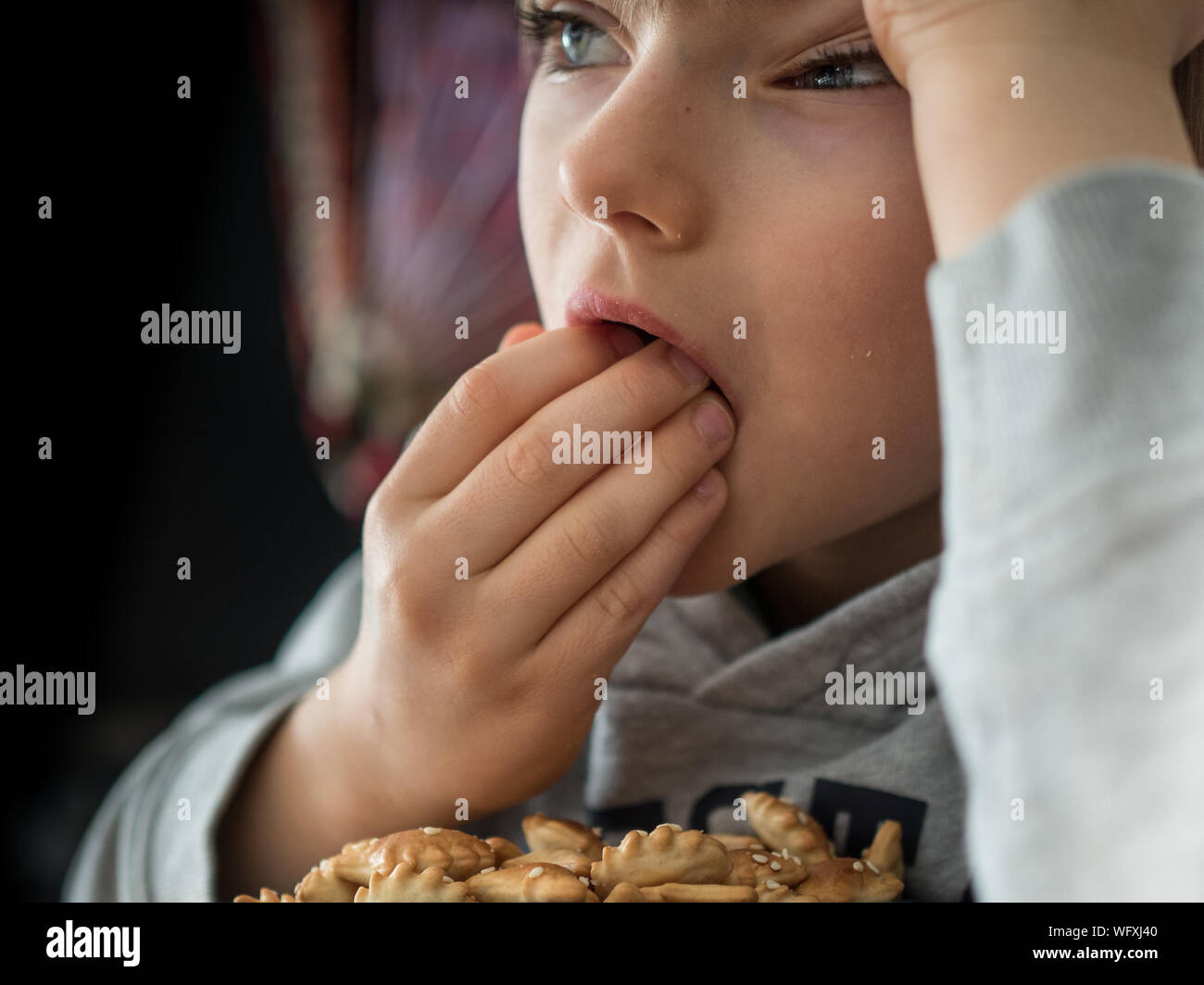 Boy eating biscuits hi-res stock photography and images - Alamy