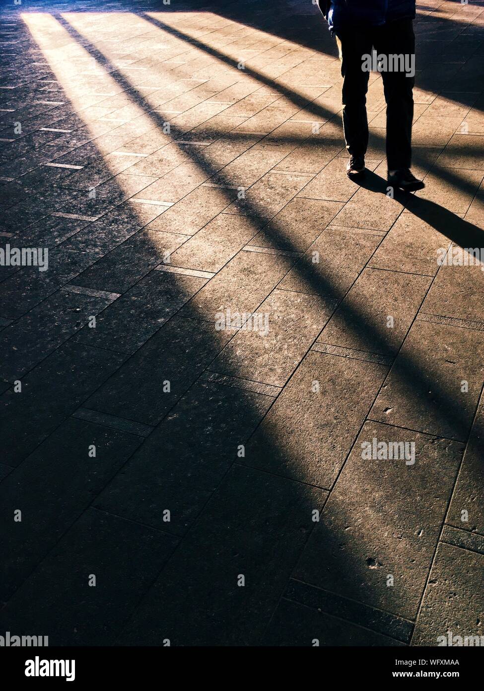 Man walking on paving hi-res stock photography and images - Alamy