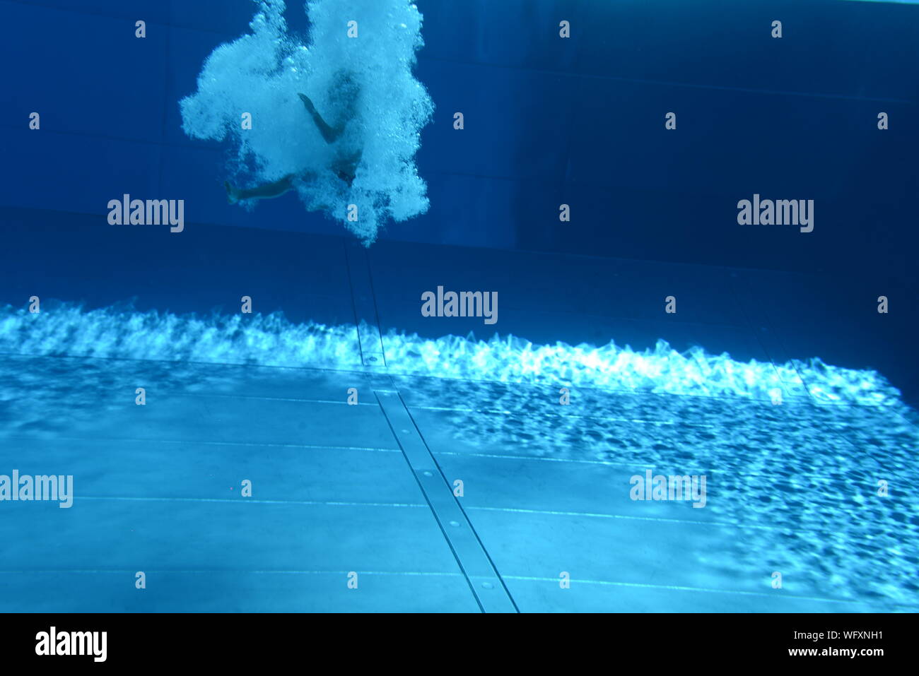 Man diving into pool hi-res stock photography and images - Alamy