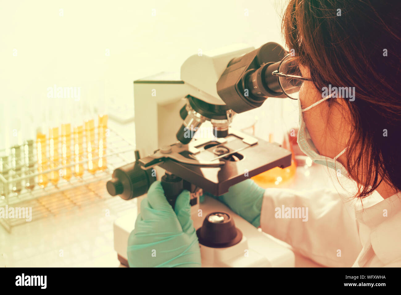 Woman and microscope hi-res stock photography and images - Alamy