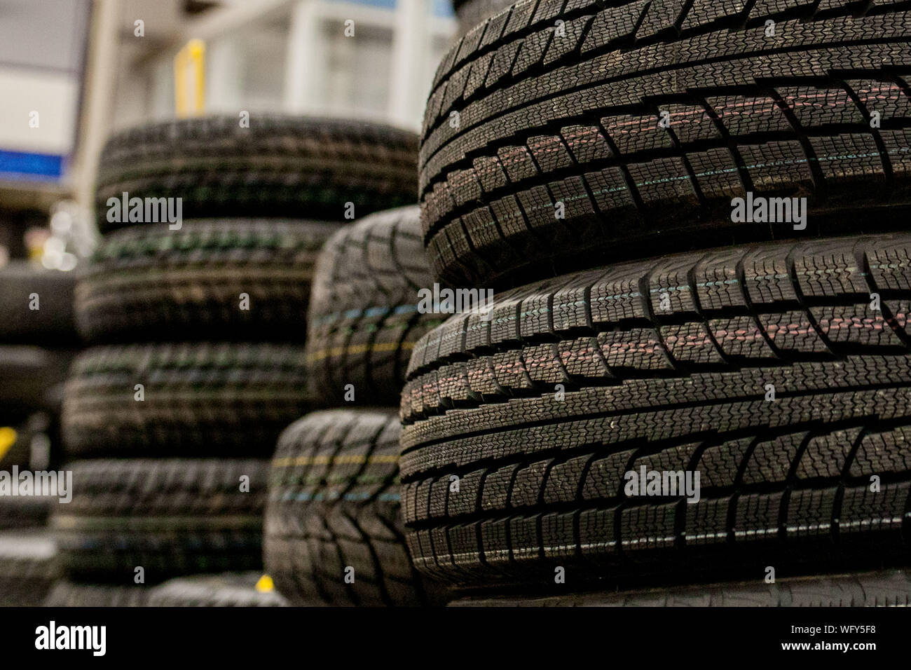 Car tires and wheels at warehouse in tire store Stock Photo - Alamy