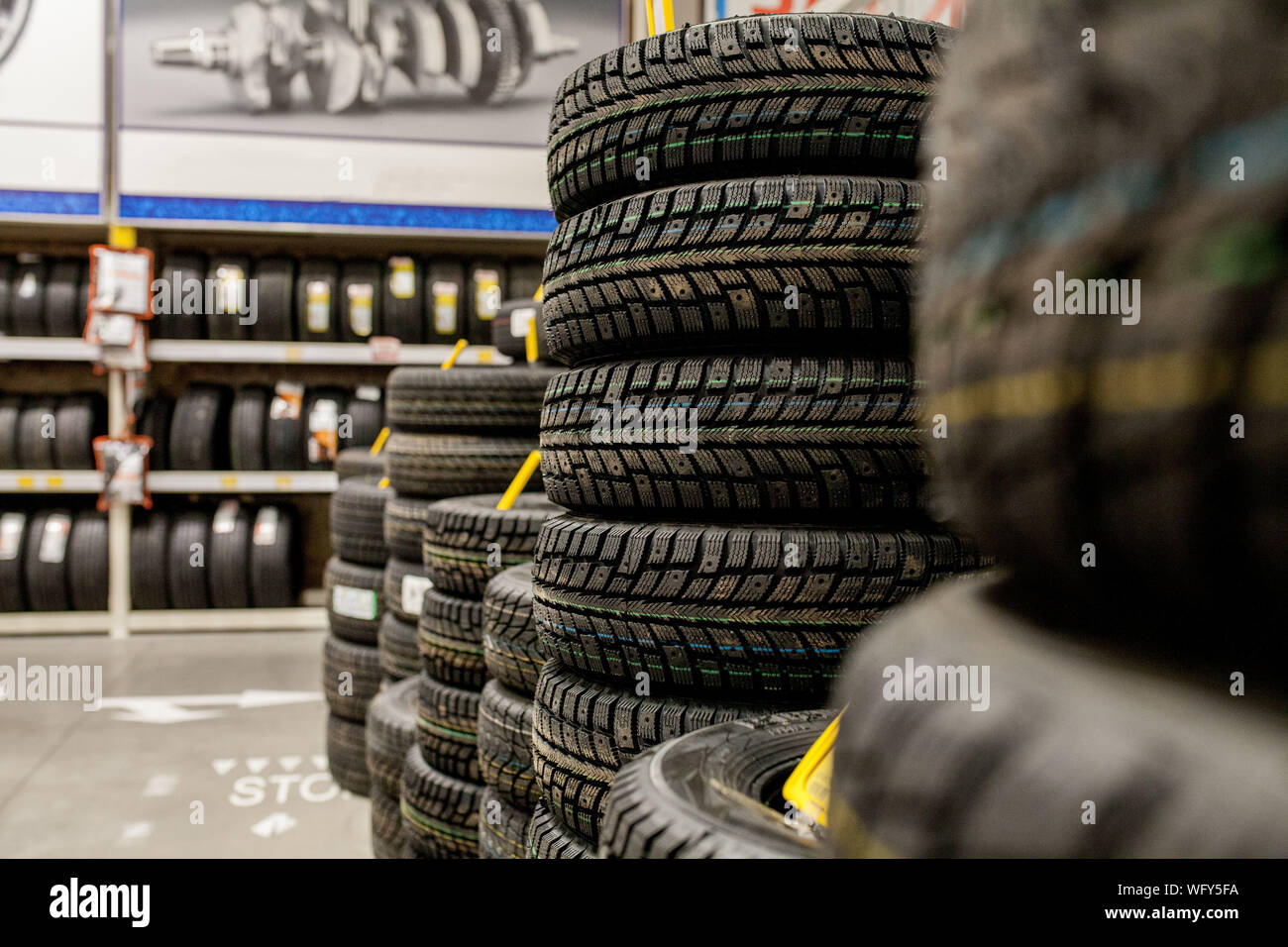 Car tires and wheels at warehouse in tire store Stock Photo - Alamy