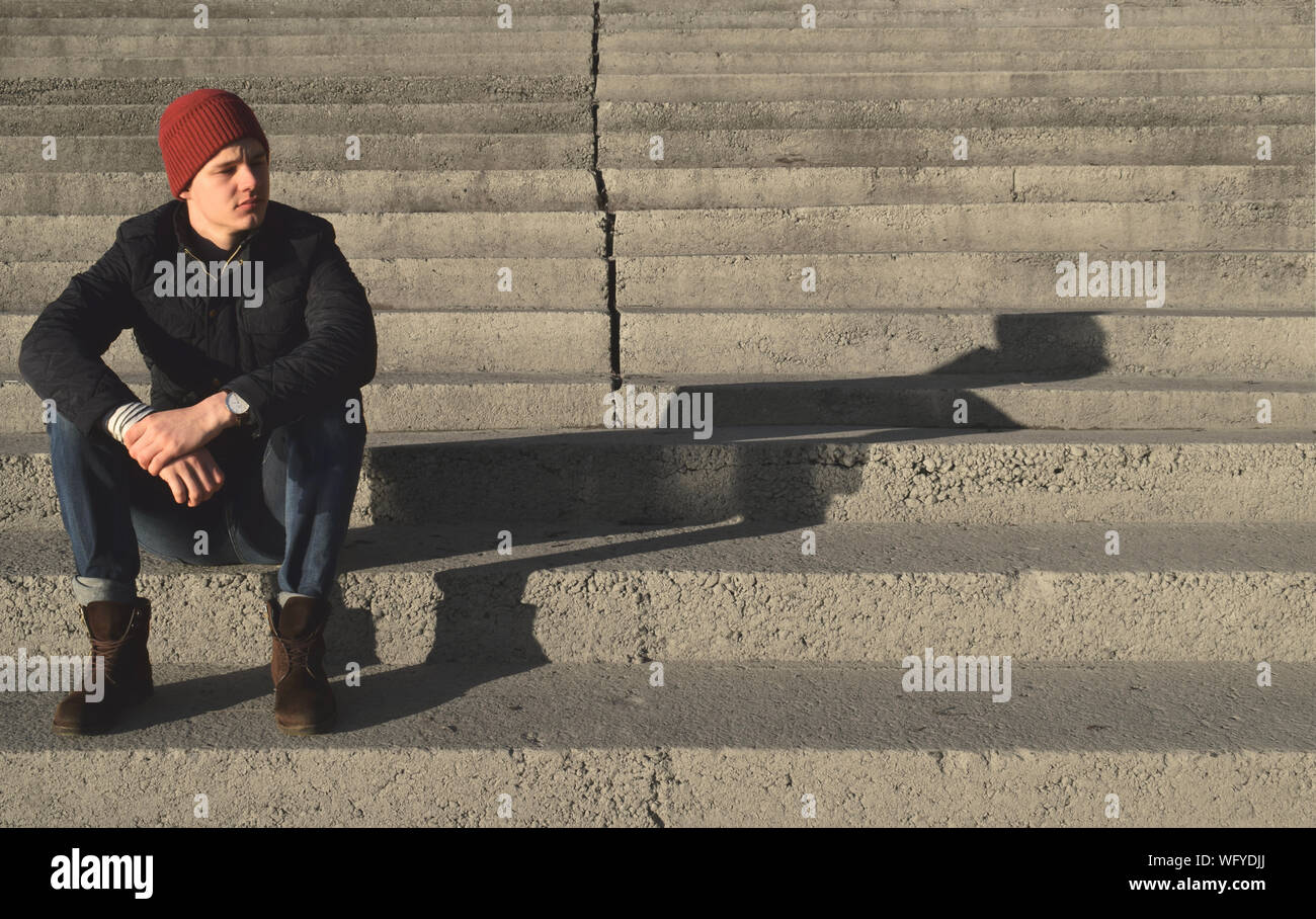 Sitting on concrete steps hi-res stock photography and images - Alamy
