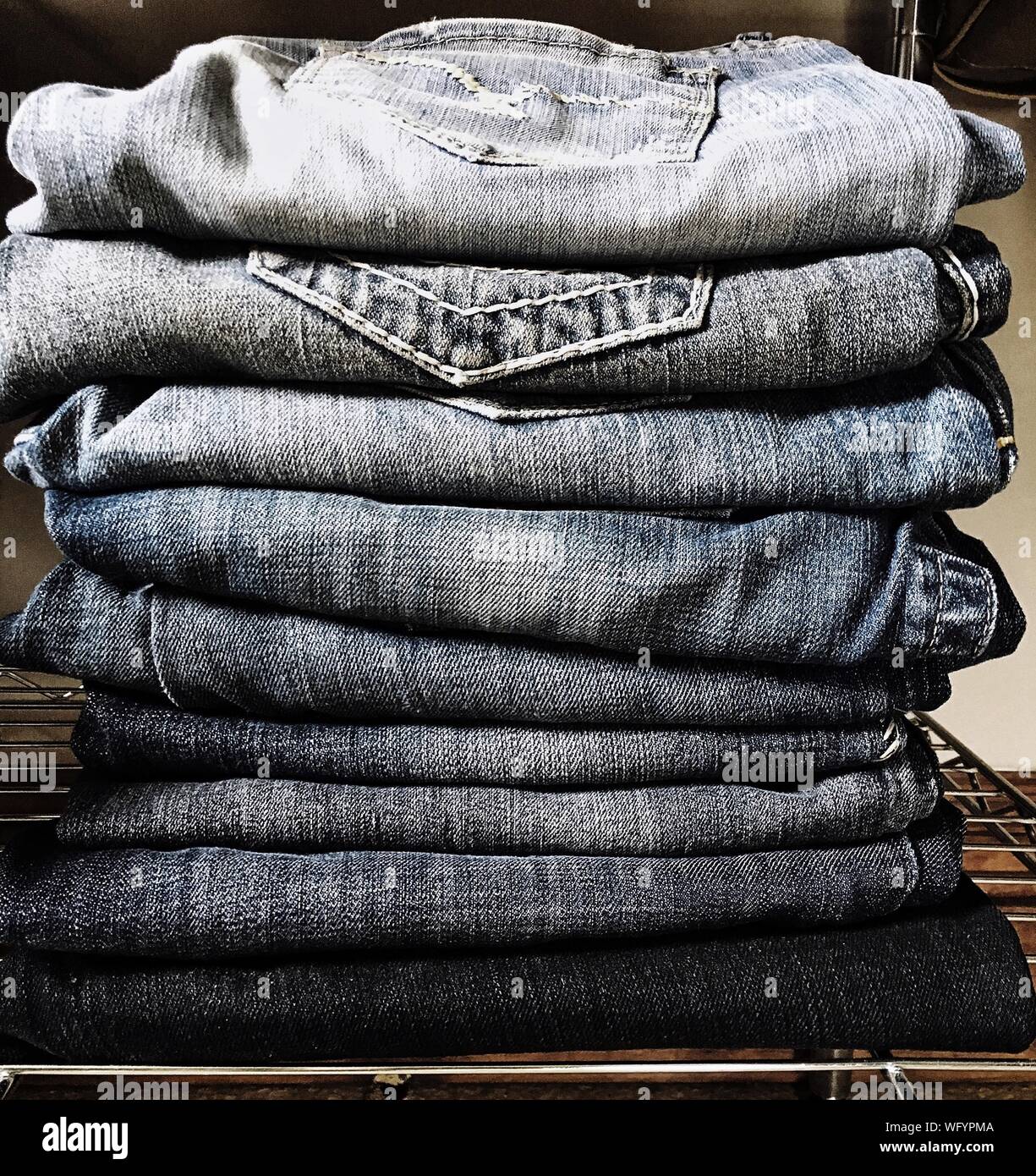 Folded denim hi-res stock photography and images - Alamy