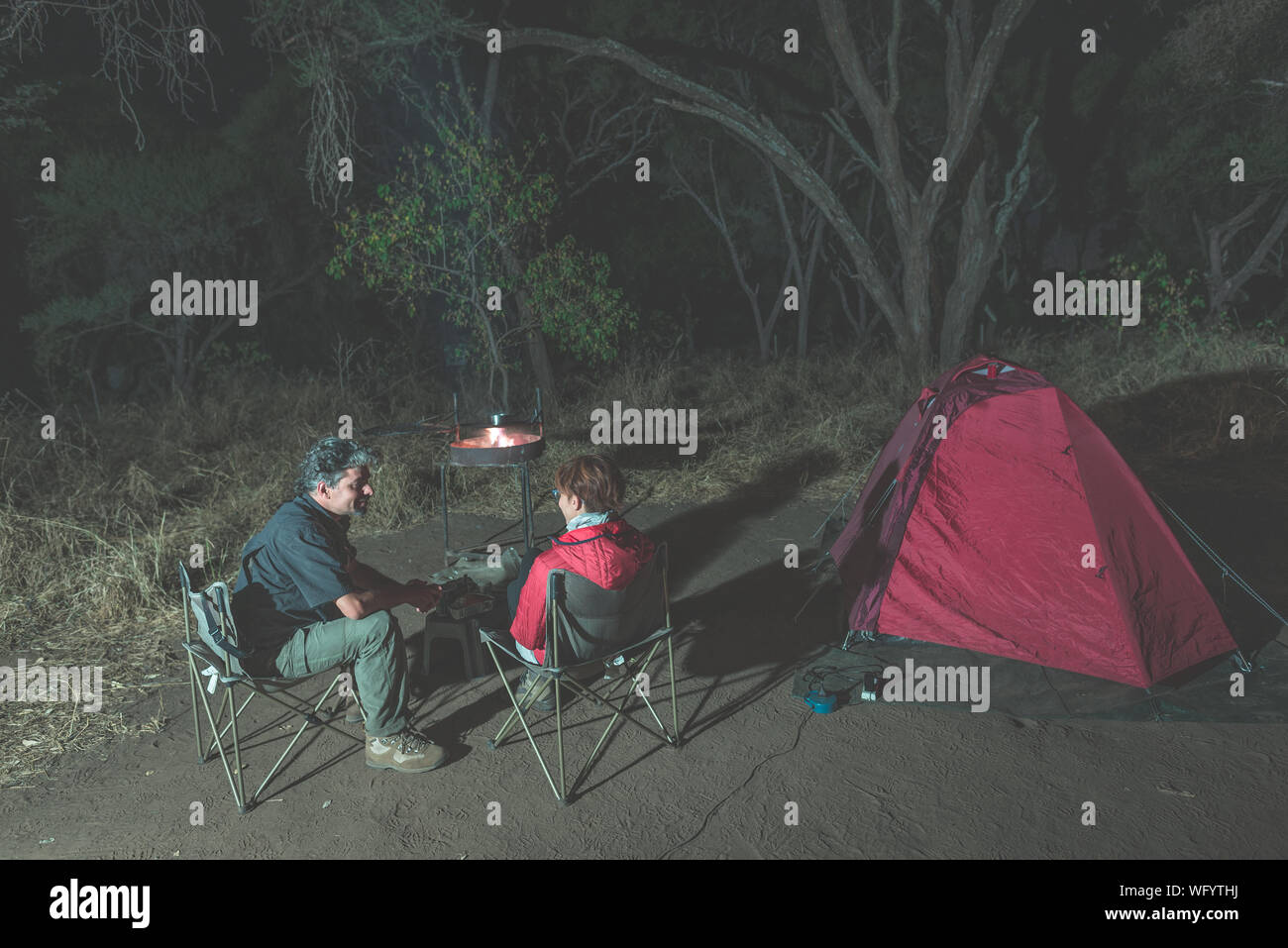 Sitting at fire hi-res stock photography and images - Alamy