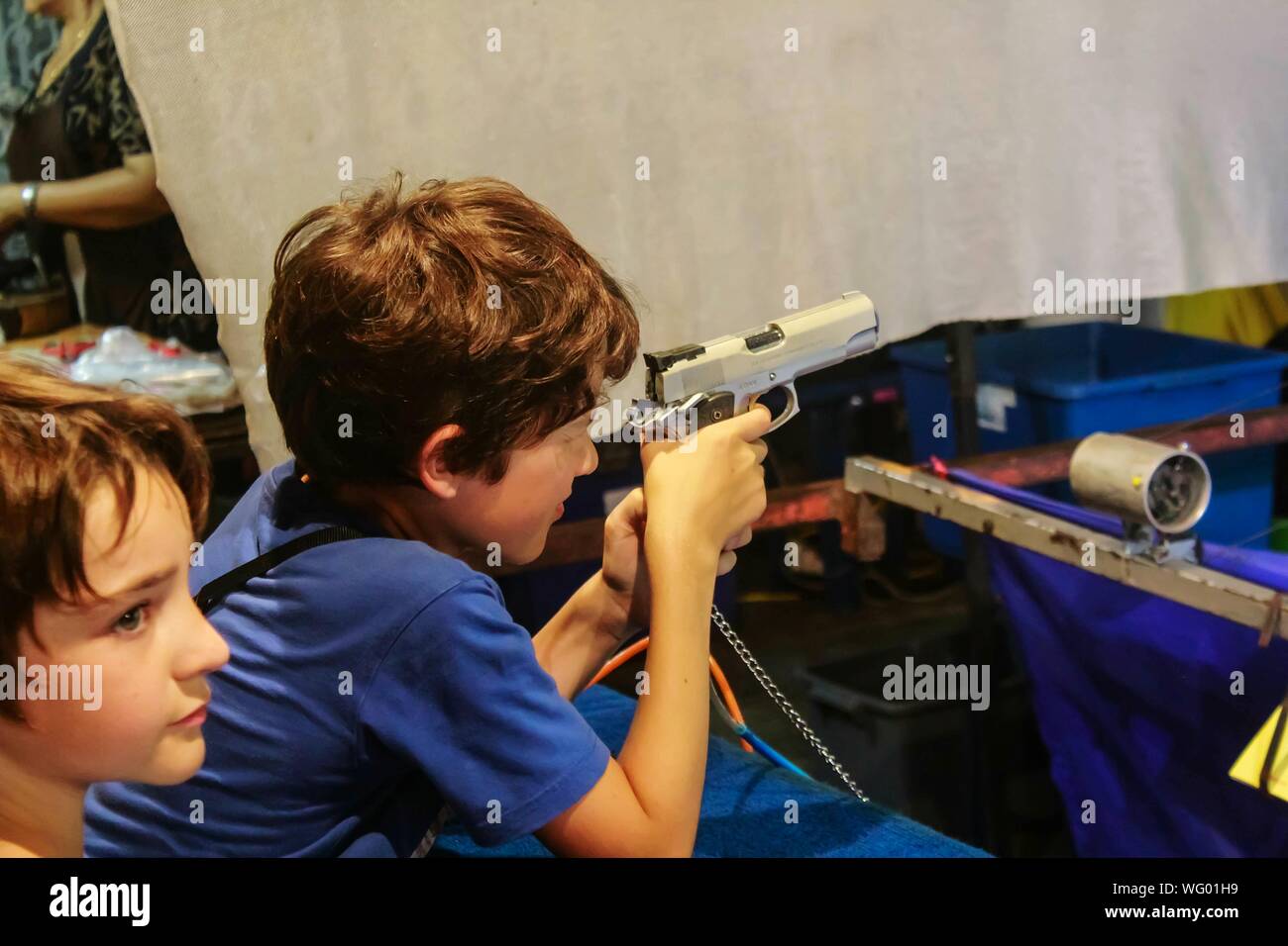 Boy playing with gun hi-res stock photography and images - Alamy